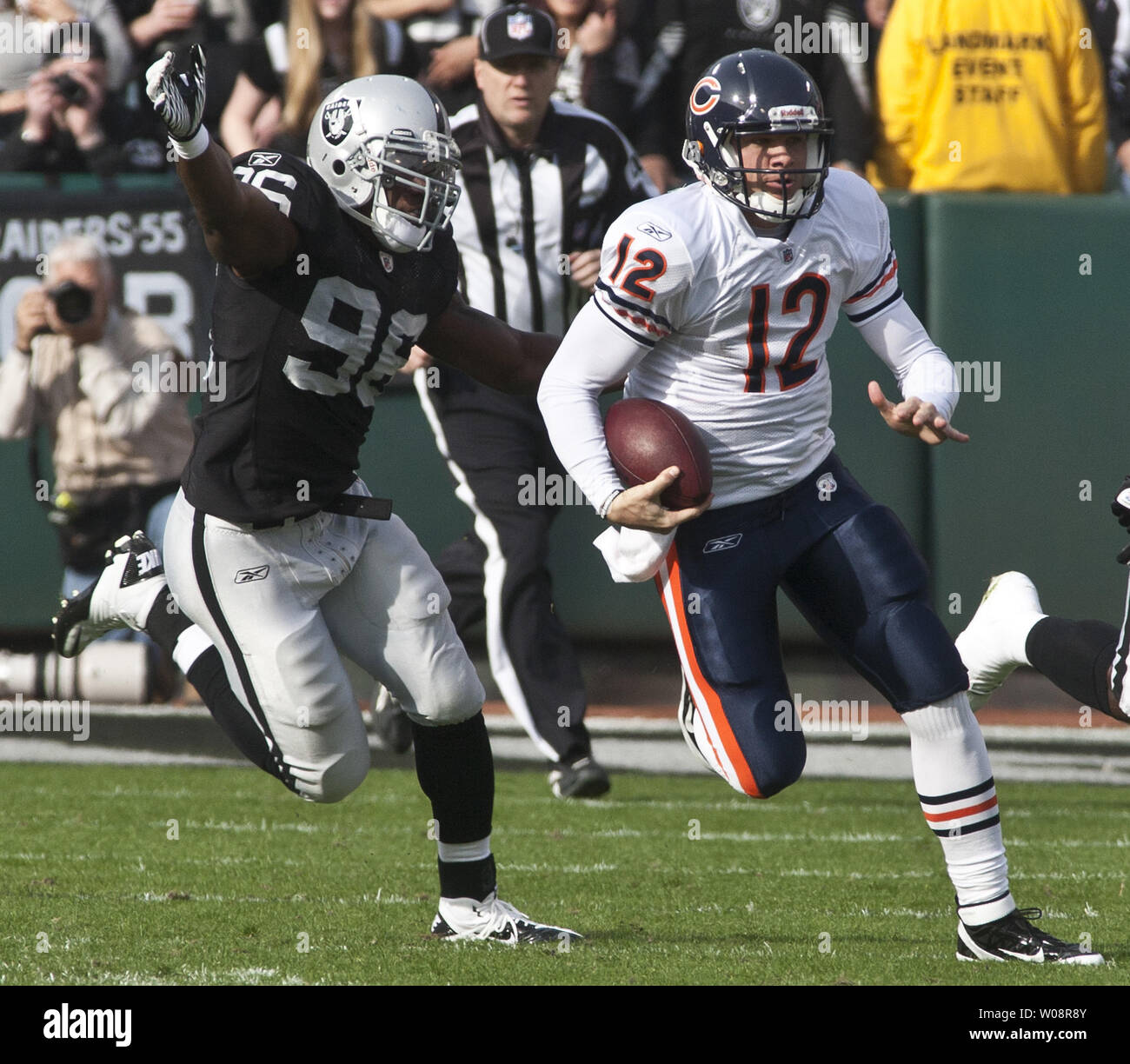 Chicago Bears QB Caleb Hanie (12) scrambles away from Oakland Raiders ...