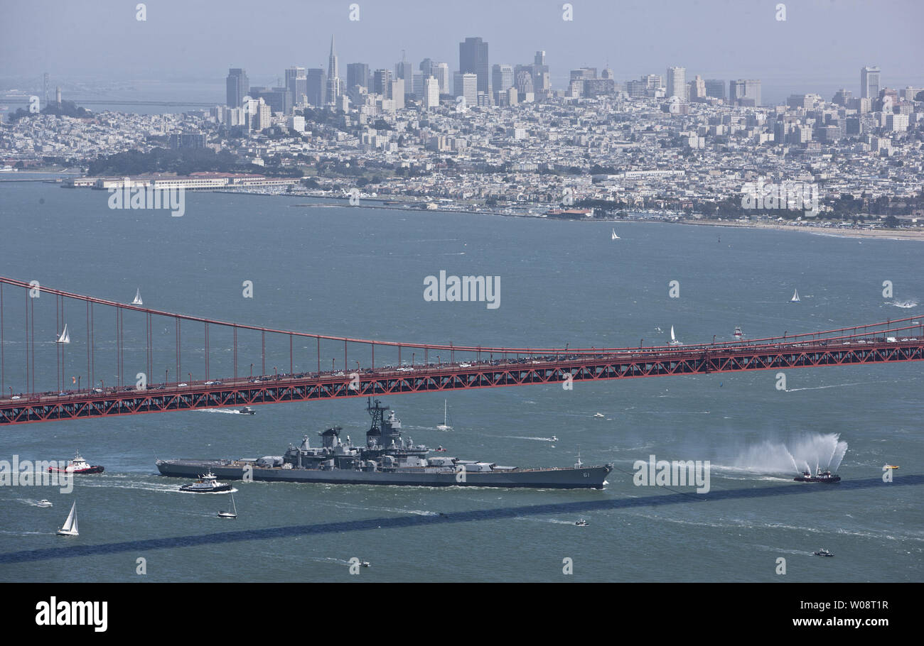 The battleship USS Iowa is towed under the Golden Gate Bridge in San ...