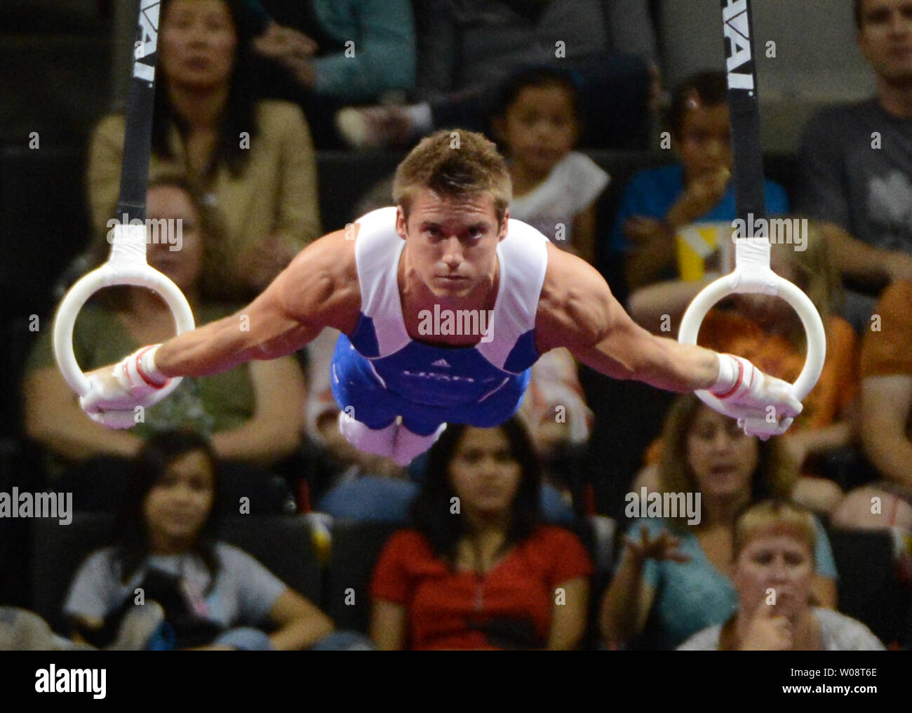 Sam Mikulak performs his routine on the still rings at the US Olympic ...