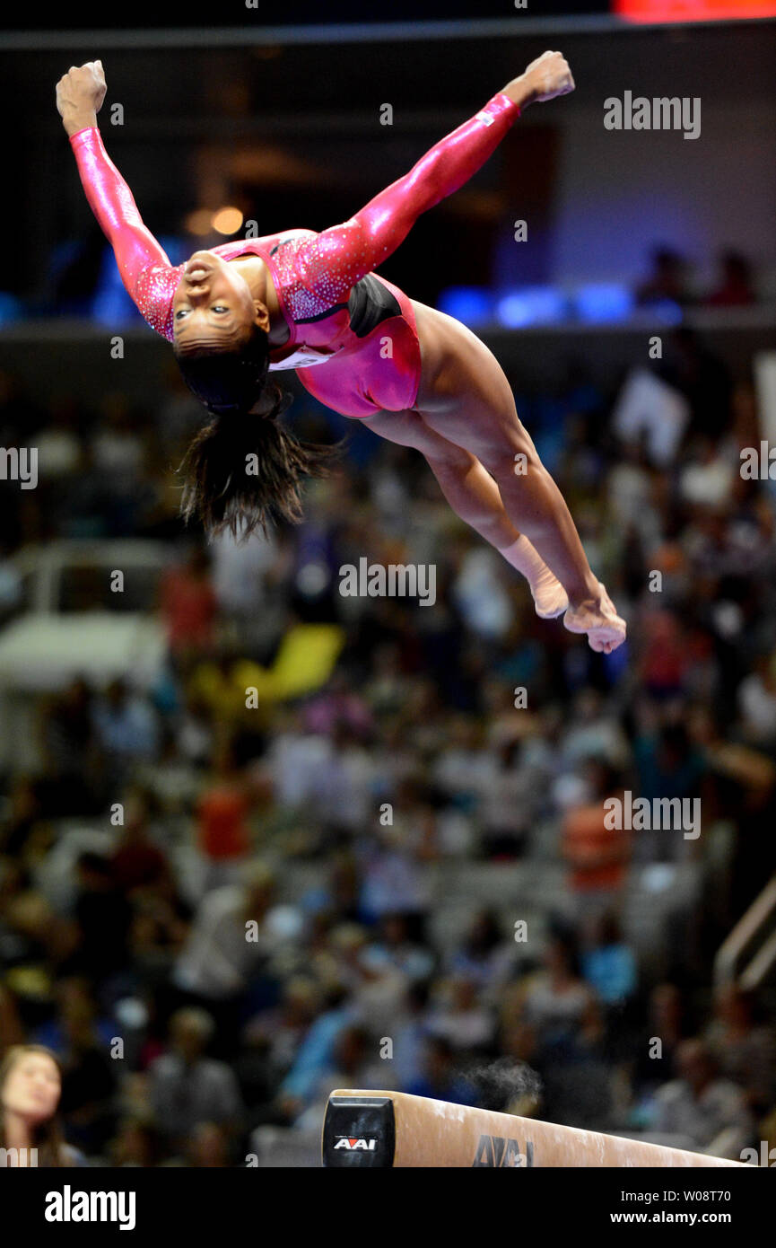 Gabrielle Douglas performs on the beam at the US Olympic trials in ...