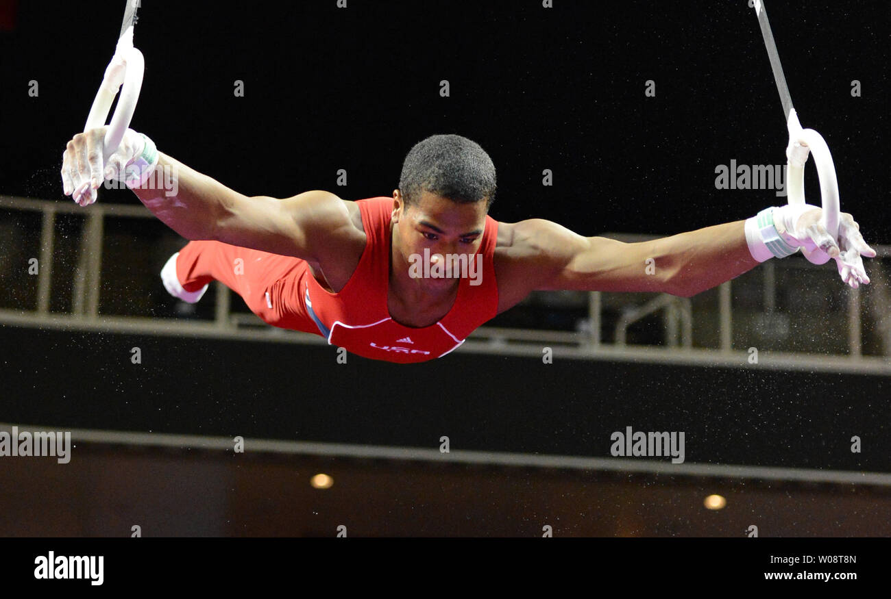 Joshua Dixon warms up on the rings at the US Olympic trials in ...