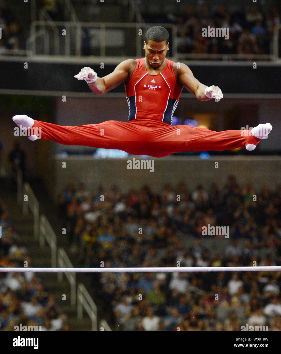 Joshua Dixon performs on the high bar at the US Olympic trials in ...