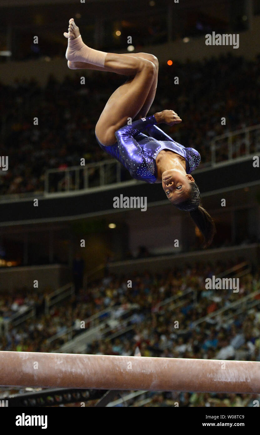Gabrielle Douglas performs on the beam at the US Olympic trials in ...