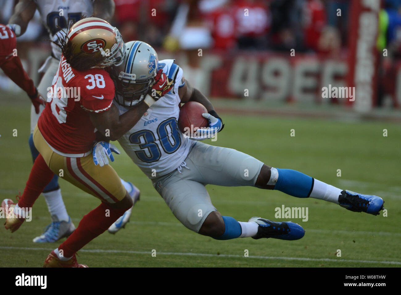 San Francisco 49ers Dashon Goldson (38) takes down Detroit Lions Kevin ...