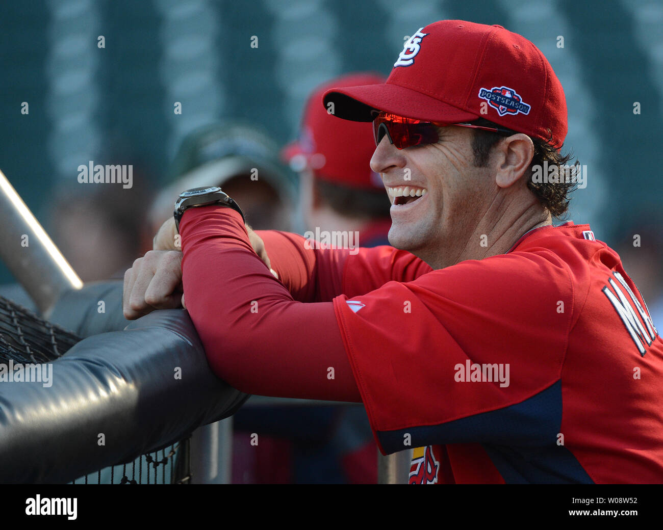 St. Louis Cardinals manager Mike Matheny laughs at batting practice ...