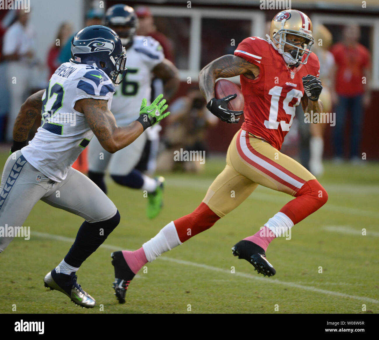 San Francisco 49ers Ted Ginn Jr. (19) eludes Seattle Seahawks Jeron ...