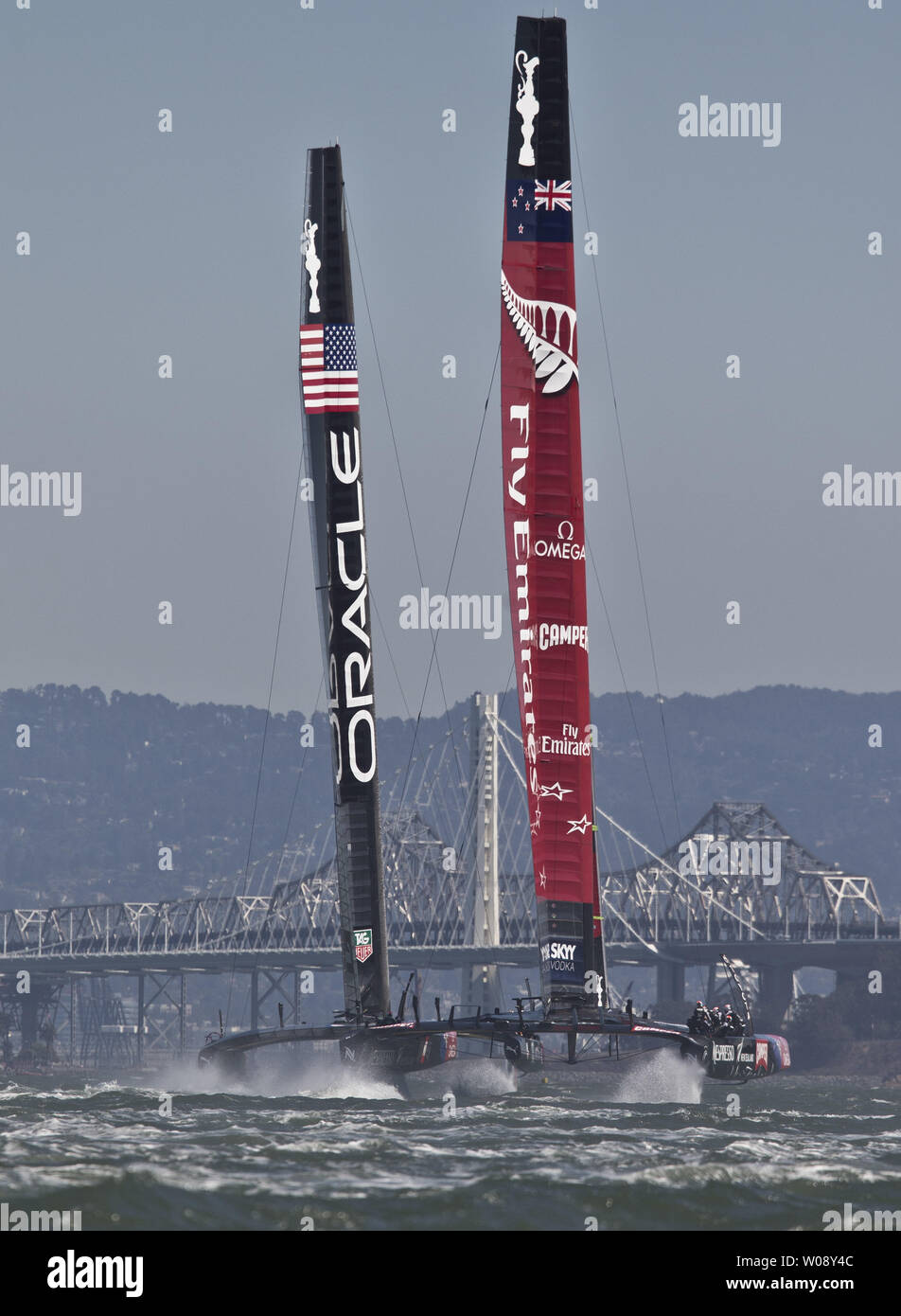 Emirates New Zealand (L) chases Oracle Team USA downwind in race nine ...