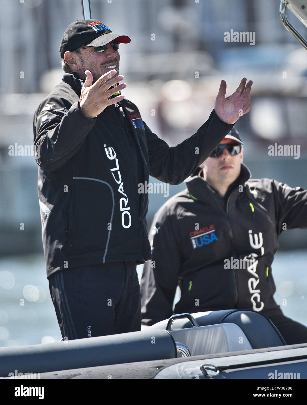 Oracle CEO Larry Ellison celebrates with his team after they defeated ...