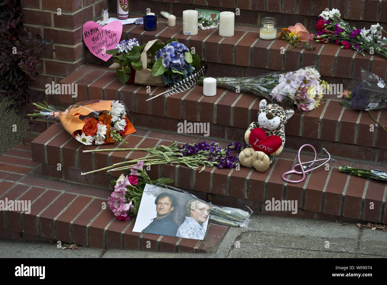 Tributes sit at a makeshift shrine to Robin Williams at the San ...