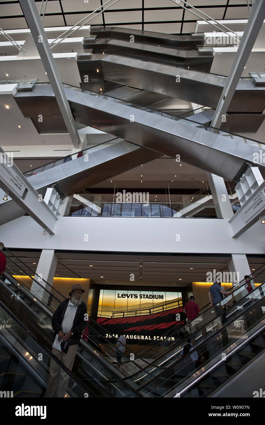 The first fans start up the escalators in the club section before the ...