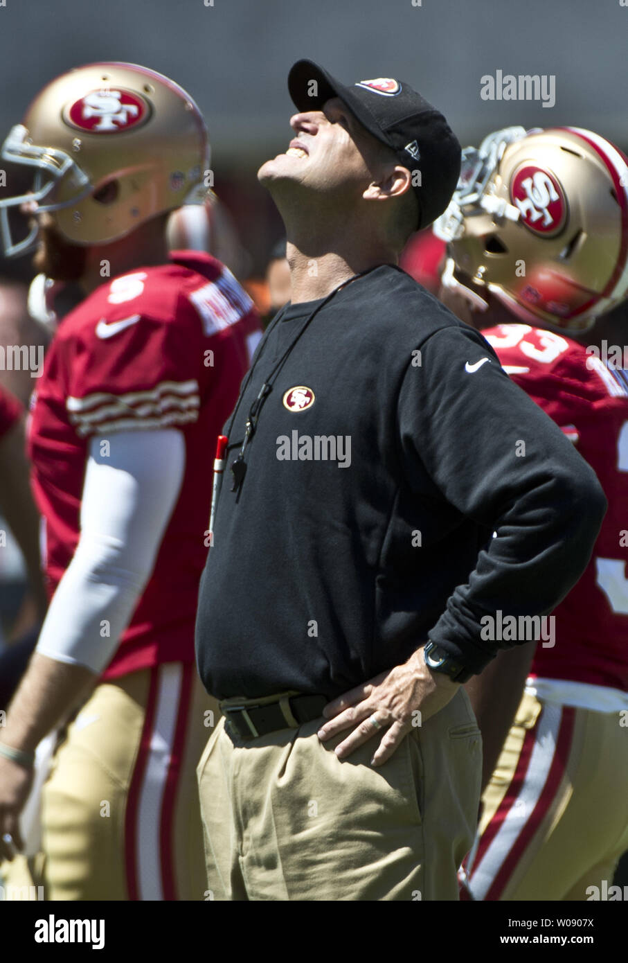 San Francisco 49ers Head Coach Jim Harbaugh looks up at the scoreboard ...