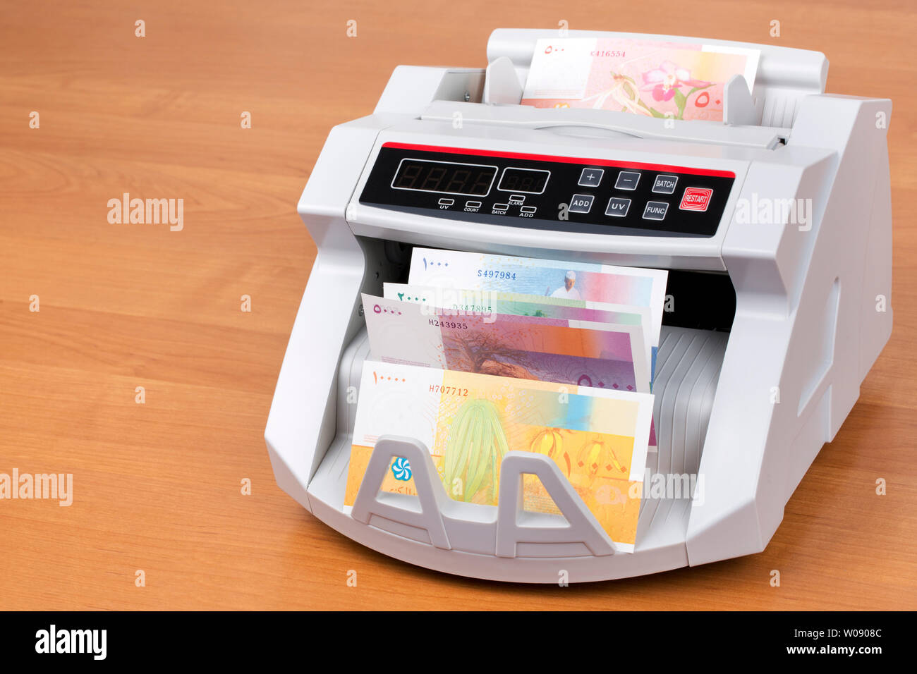 Comorian Franc in a counting machine Stock Photo - Alamy