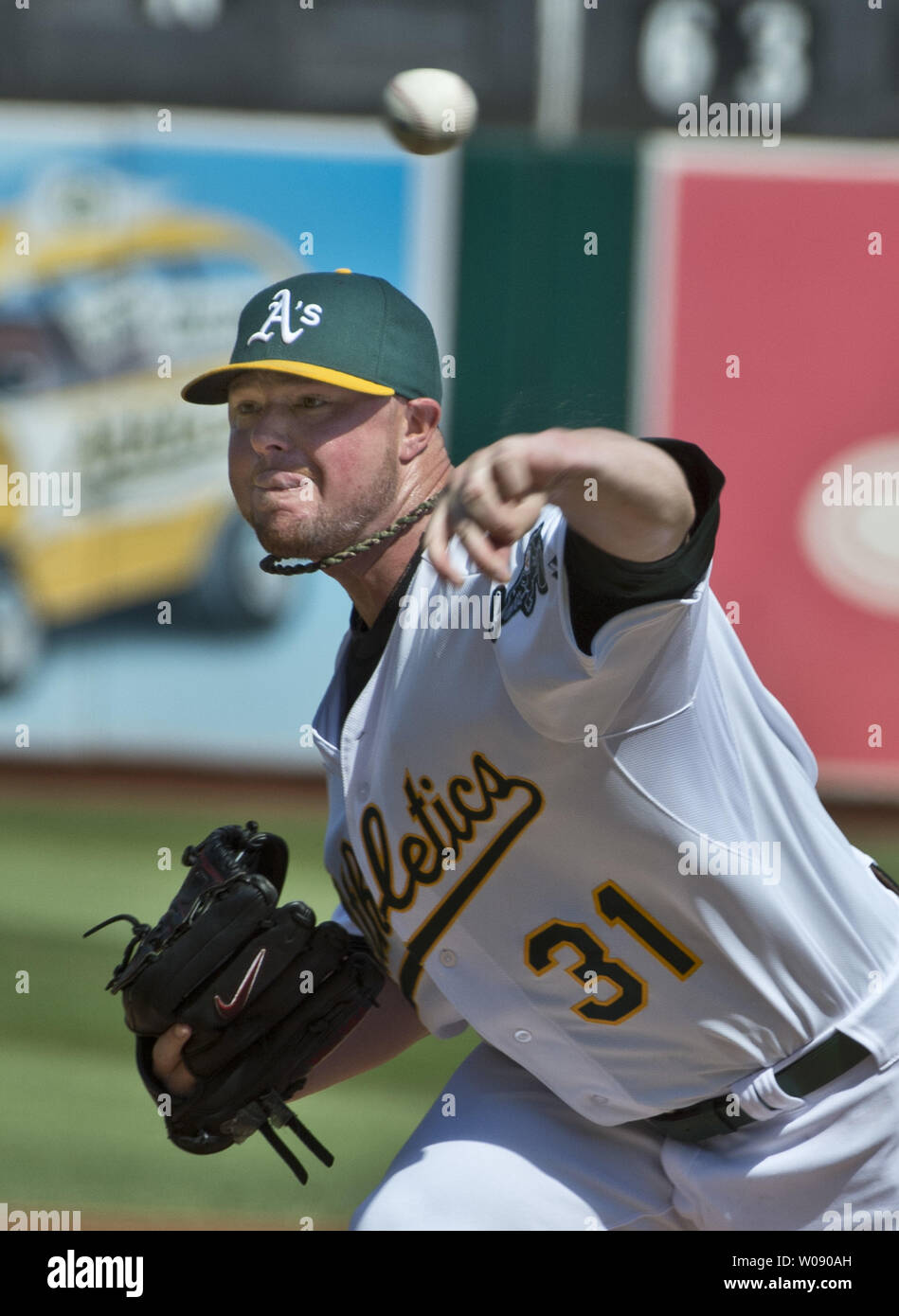 Oakland Athletics starter Jon Lester throws to the Los Angeles Angels ...