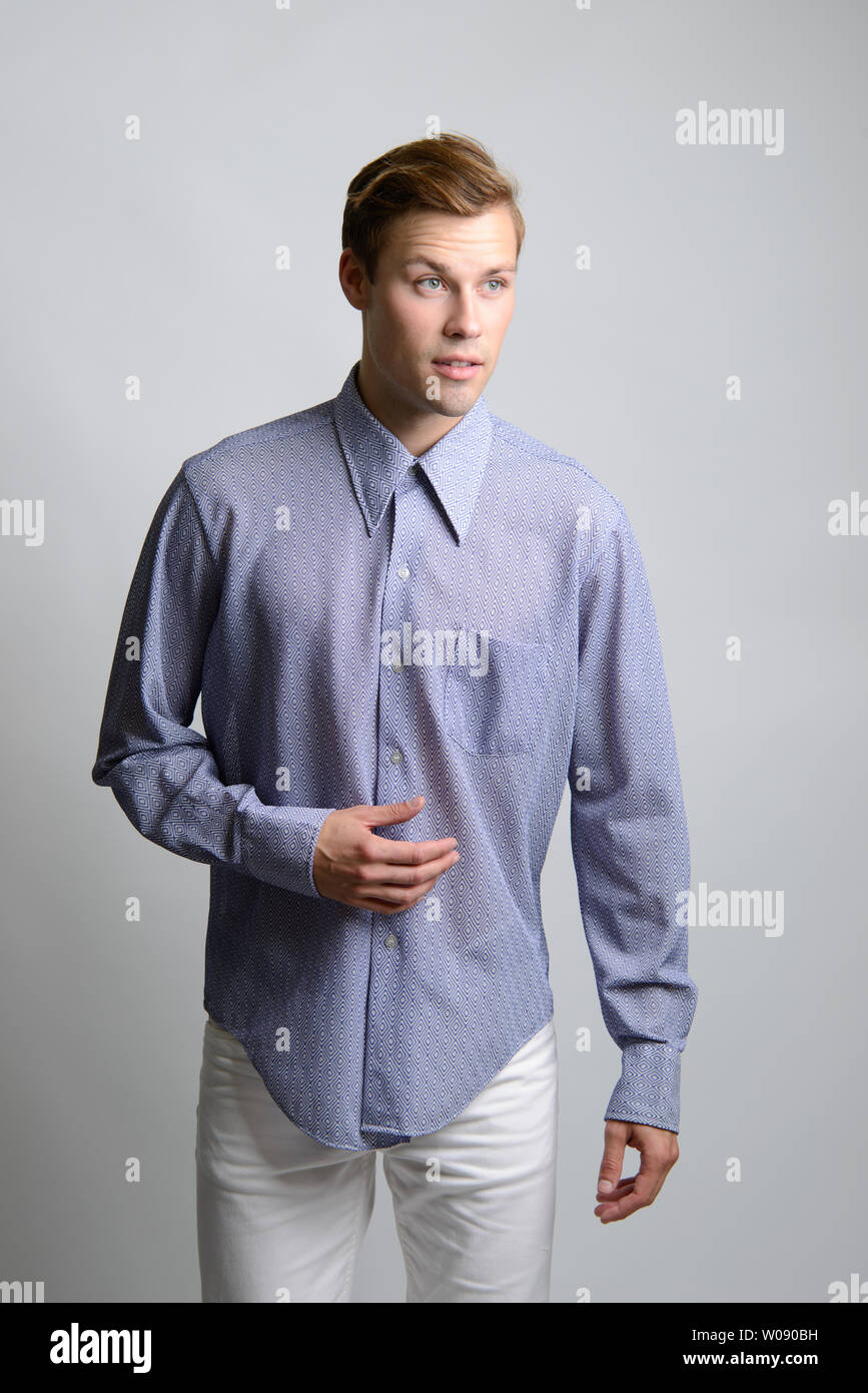 A Brown hair Caucasian male model poses in vintage clothing outfit, a ...