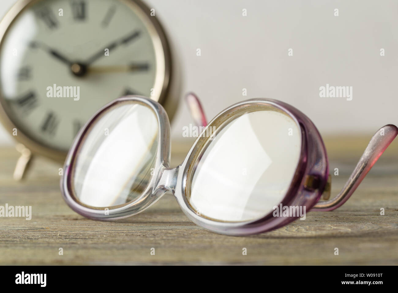 glasses and alarm clock Stock Photo - Alamy