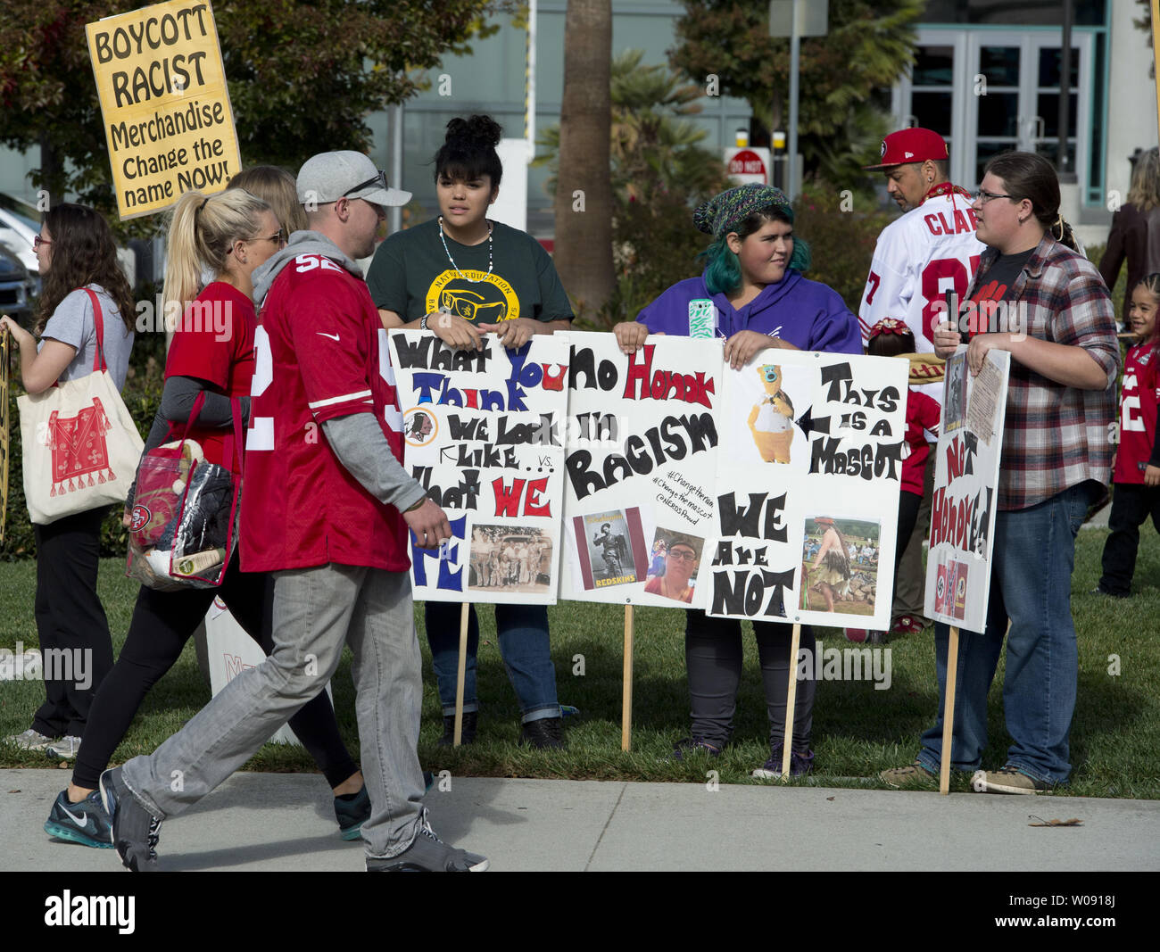 Native Americans demonstrate in front of fans arriving for the San ...