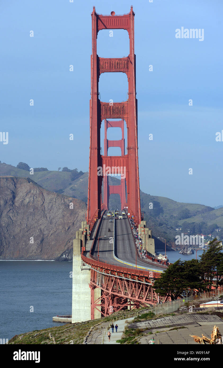 Workers install a movable median barrier on the Golden Gate Bridge in ...