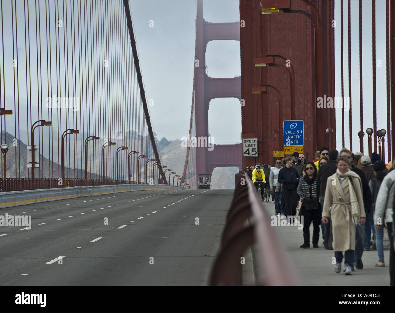 Pedestrians cross the Golden Gate Bridge on January 11, 2015 in San ...