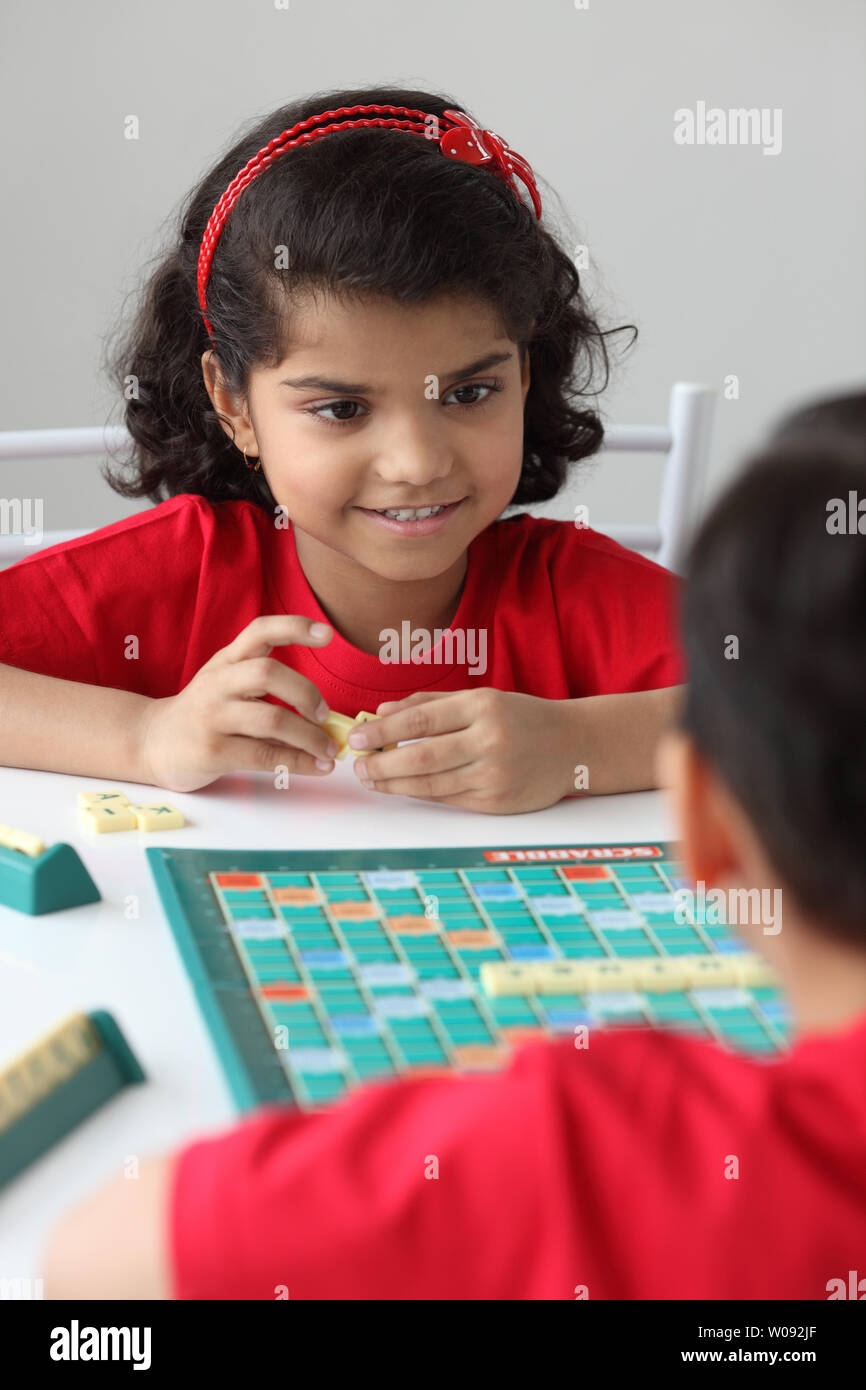 Two friends playing word game Stock Photo - Alamy