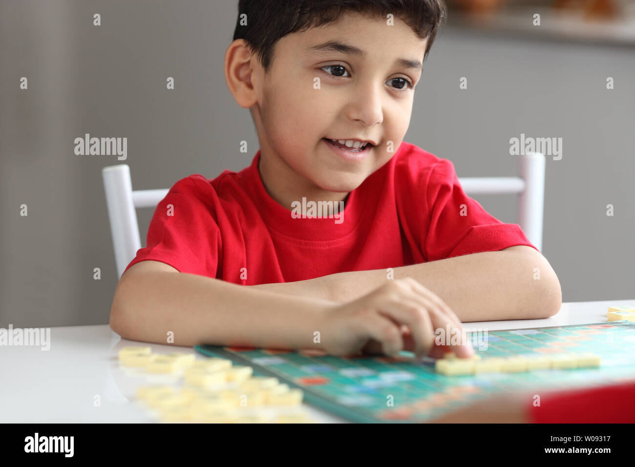 Boy playing word game Stock Photo - Alamy