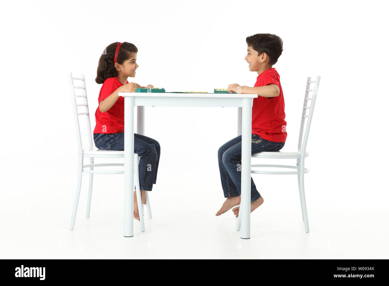 Two friends playing word game Stock Photo - Alamy