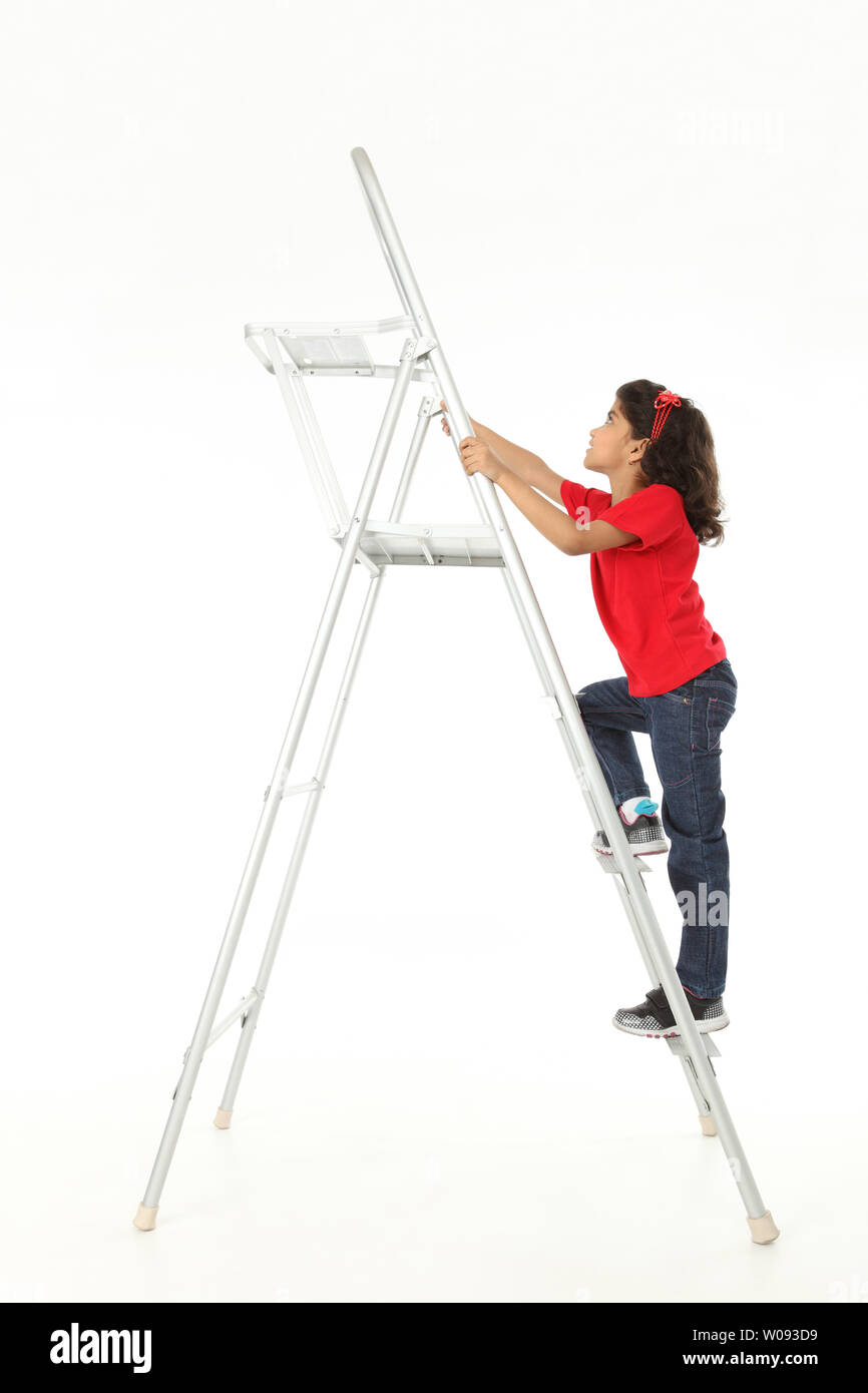 Girl climbing on a step ladder Stock Photo - Alamy