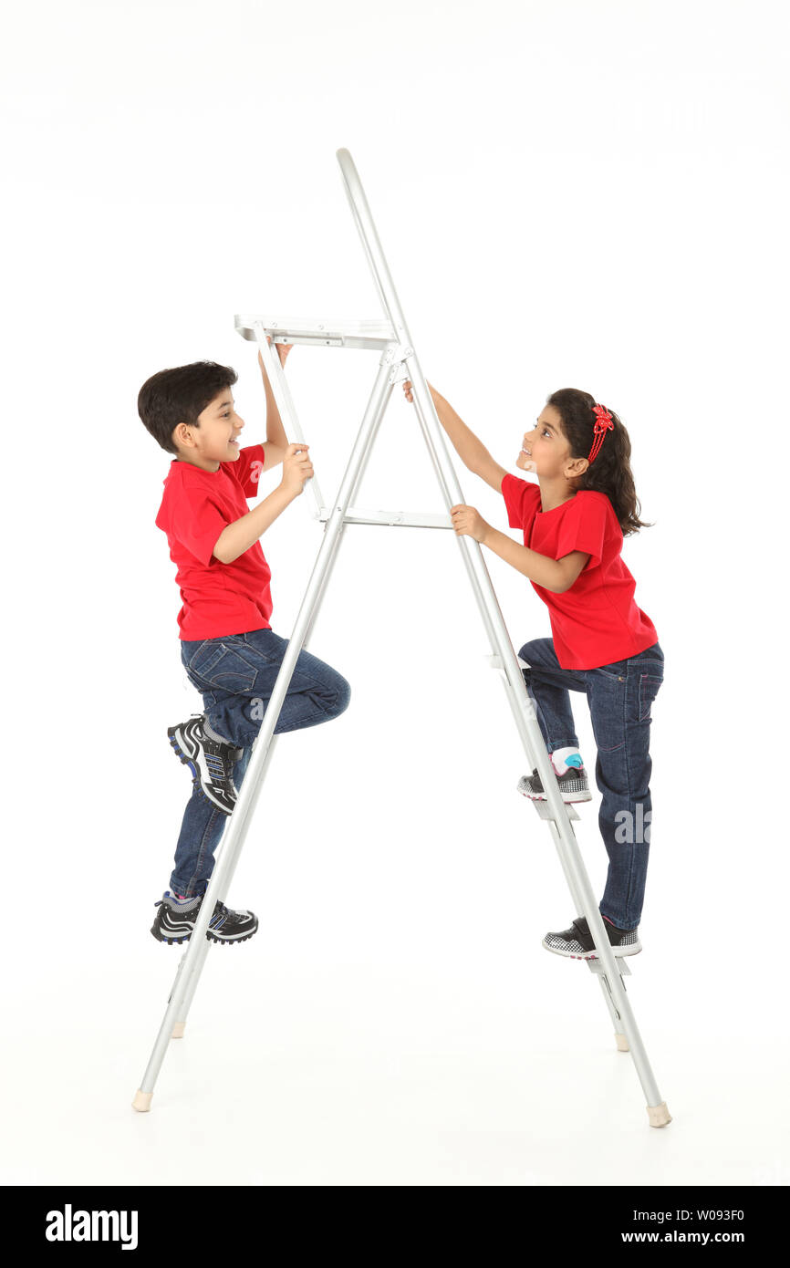 Boy climbing steps ladder hi-res stock photography and images - Alamy