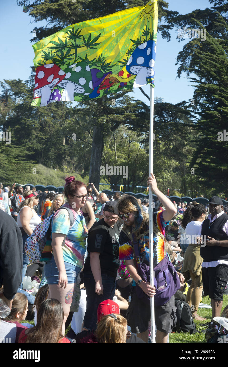 A participant flies a flag at the first sponsored 420 event in Golden ...