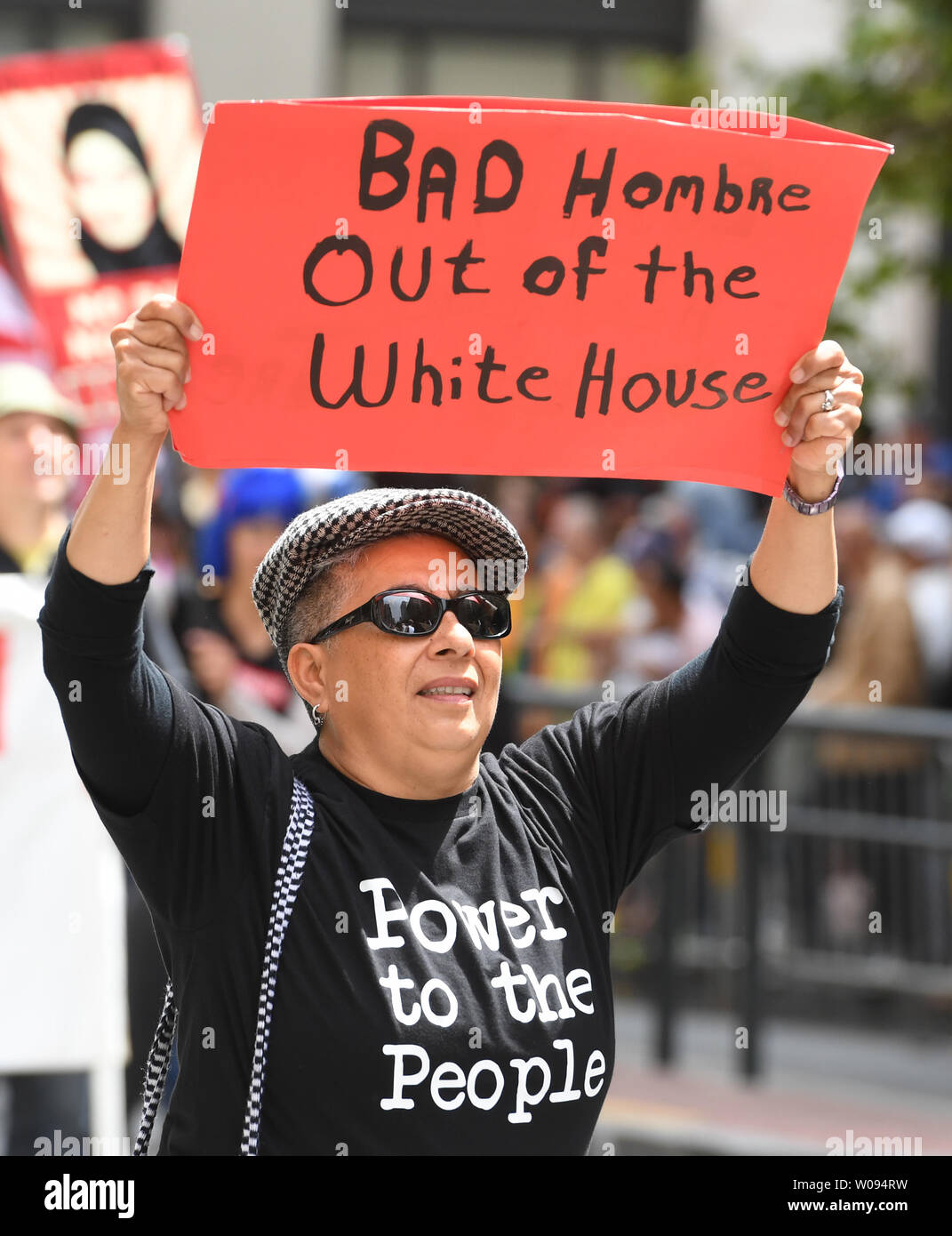 Political signs are carried in the annual LGBT Pride Parade in San ...