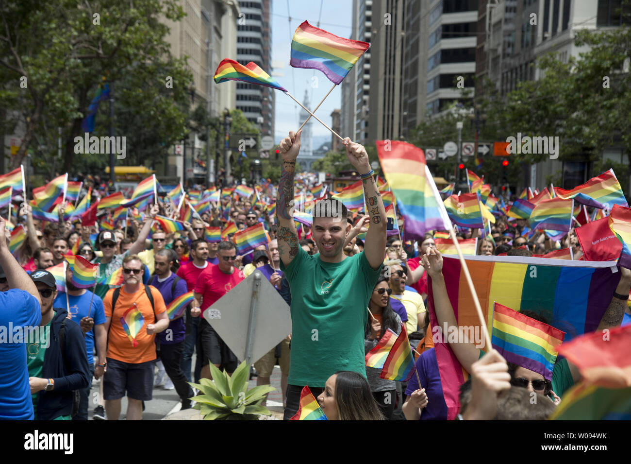 A contingent from Apple Combuter marches up Market Street in the annual LGBT Pride Parade in San ...