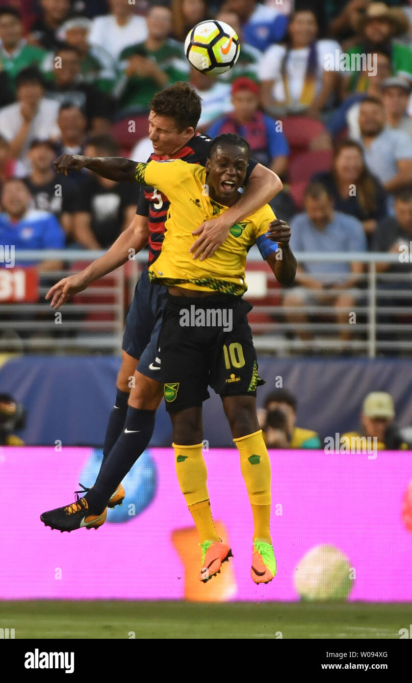 USA's Matt Bressler (L) and Jamaica's Darren Mattocks (10) fight for ...