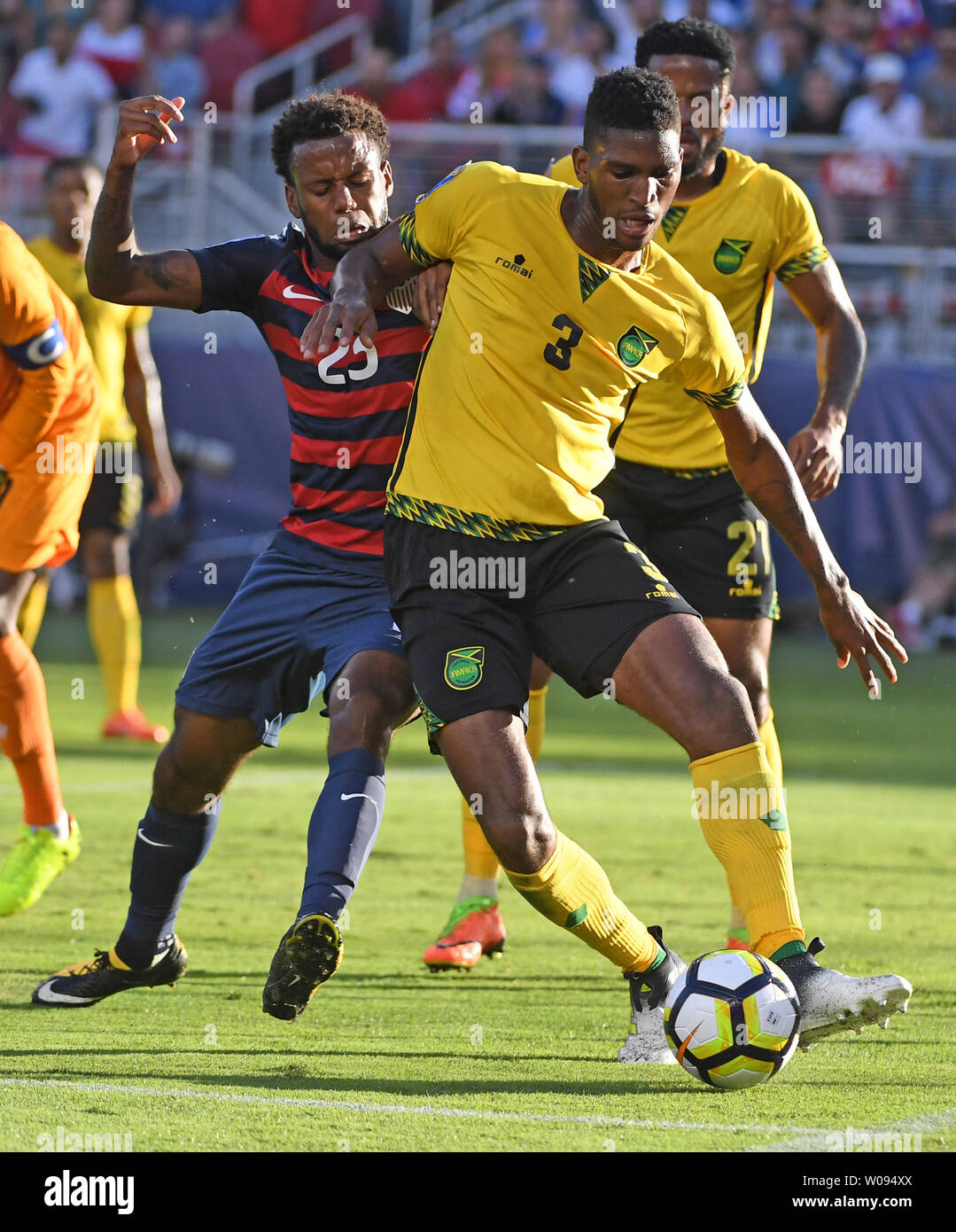 Jamaica's Damion Lowe (3) clears the ball away from USA's Kellyn Acosta ...