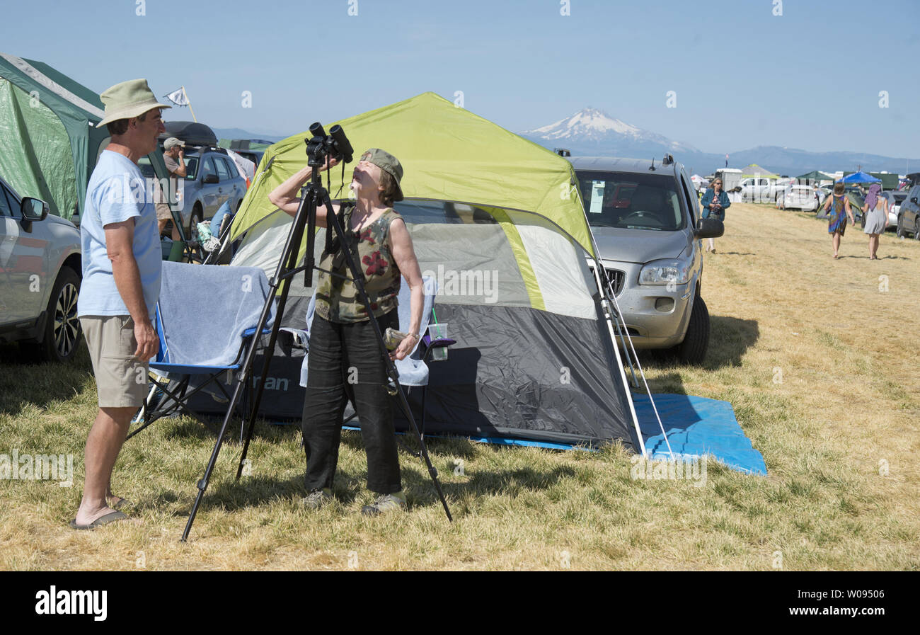A string of sun spots is viewed by a camper at Solartown in Madras ...