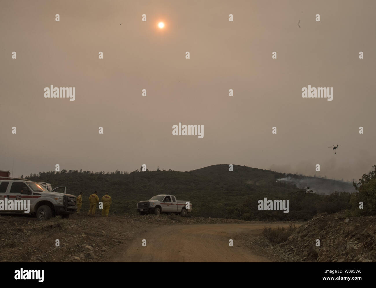 CalFire personnel set up to backfire along a ridge in Colusa County ...