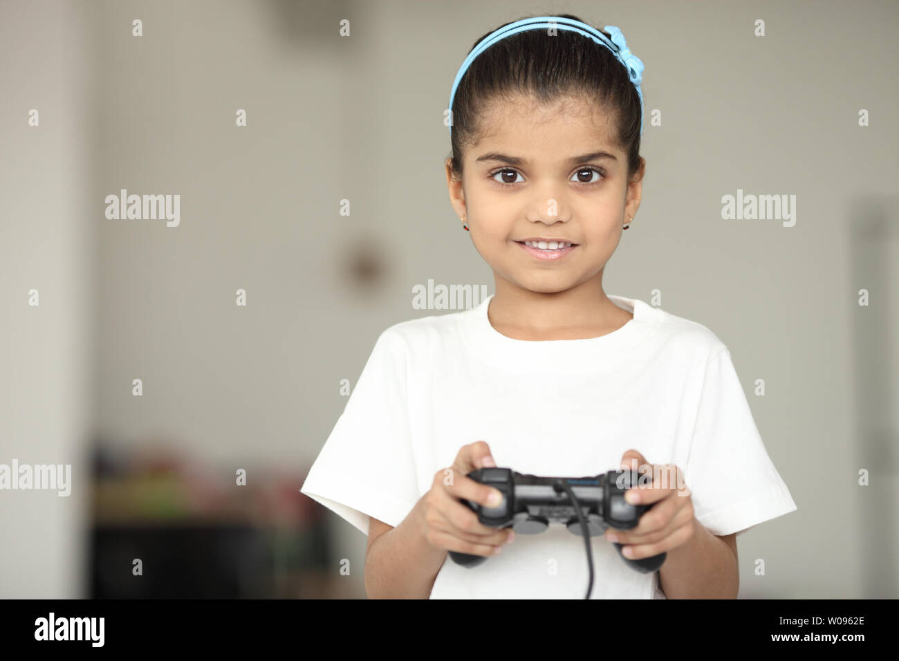 Girl playing video game Stock Photo - Alamy