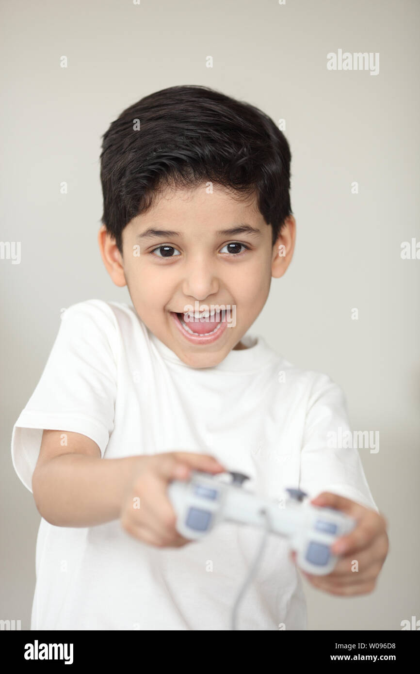 Boy playing video game Stock Photo - Alamy