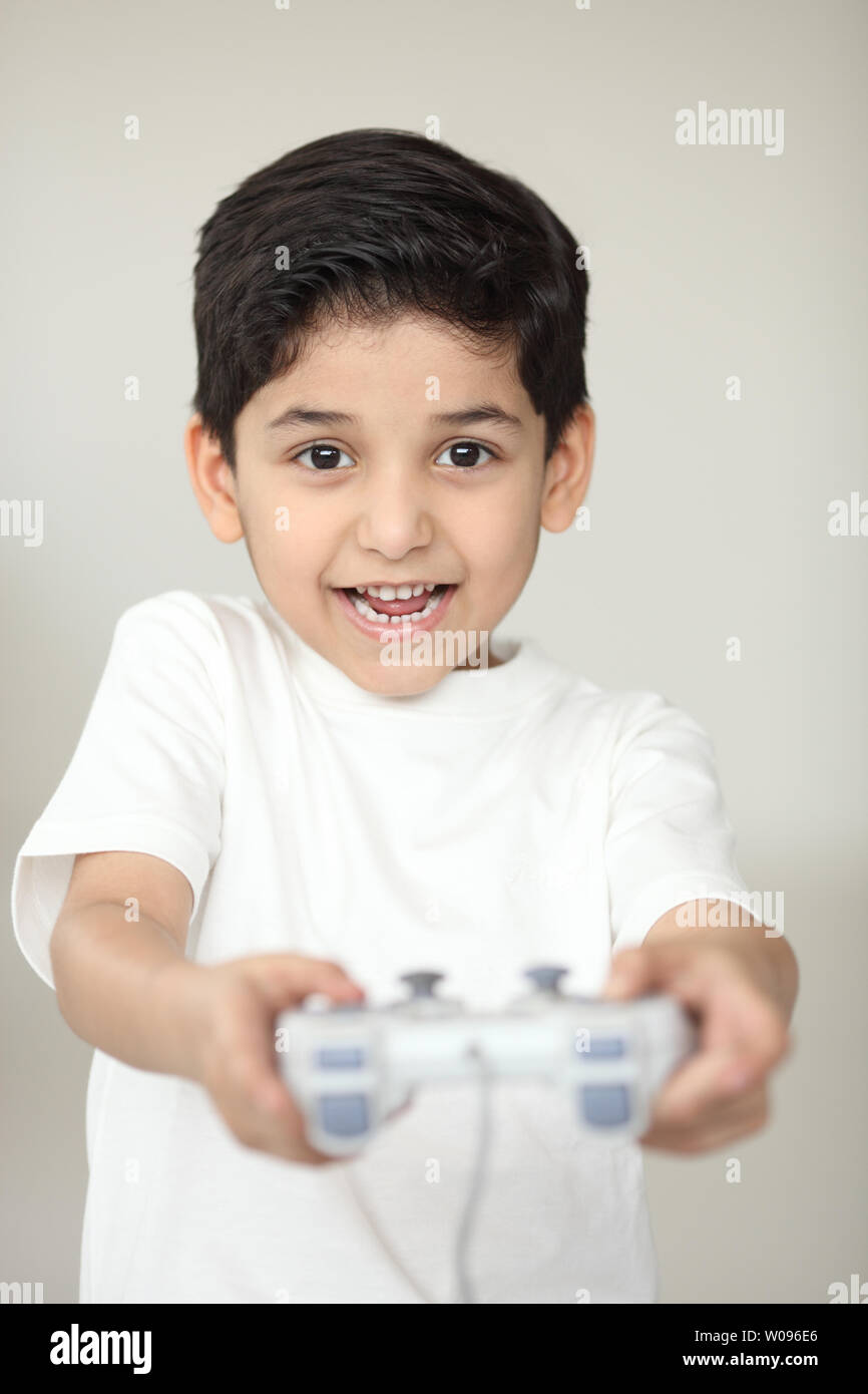 Boy playing video game Stock Photo - Alamy