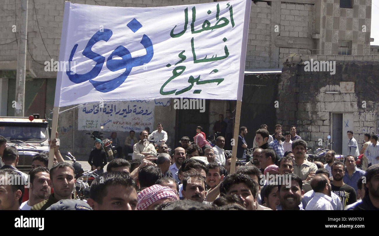 Syrian anti-government protesters hold a protest calling for the end of ...