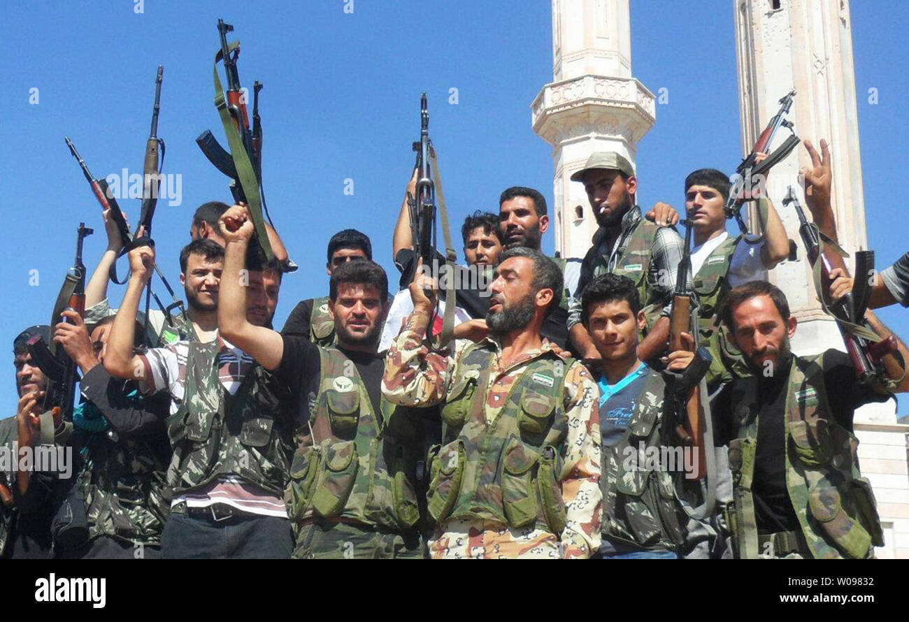 Members of the Free Syrian Army chant slogans against Syrian President ...