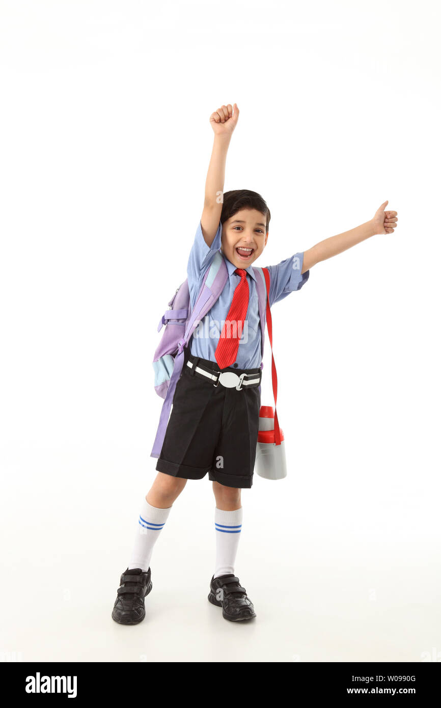 Full length school uniform arms raised hi-res stock photography and ...