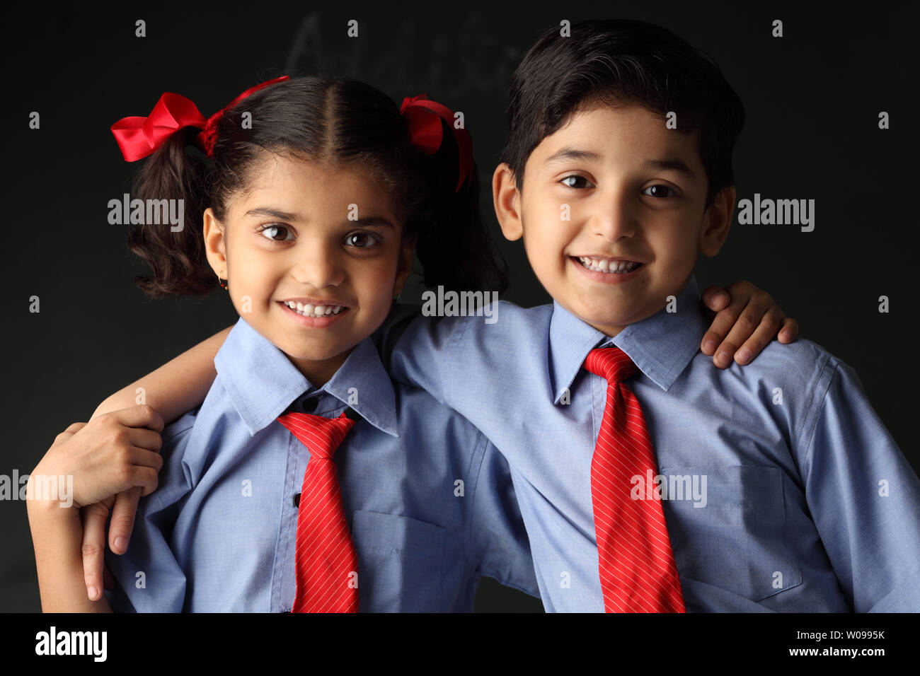 Portrait of two school children smiling Stock Photo - Alamy