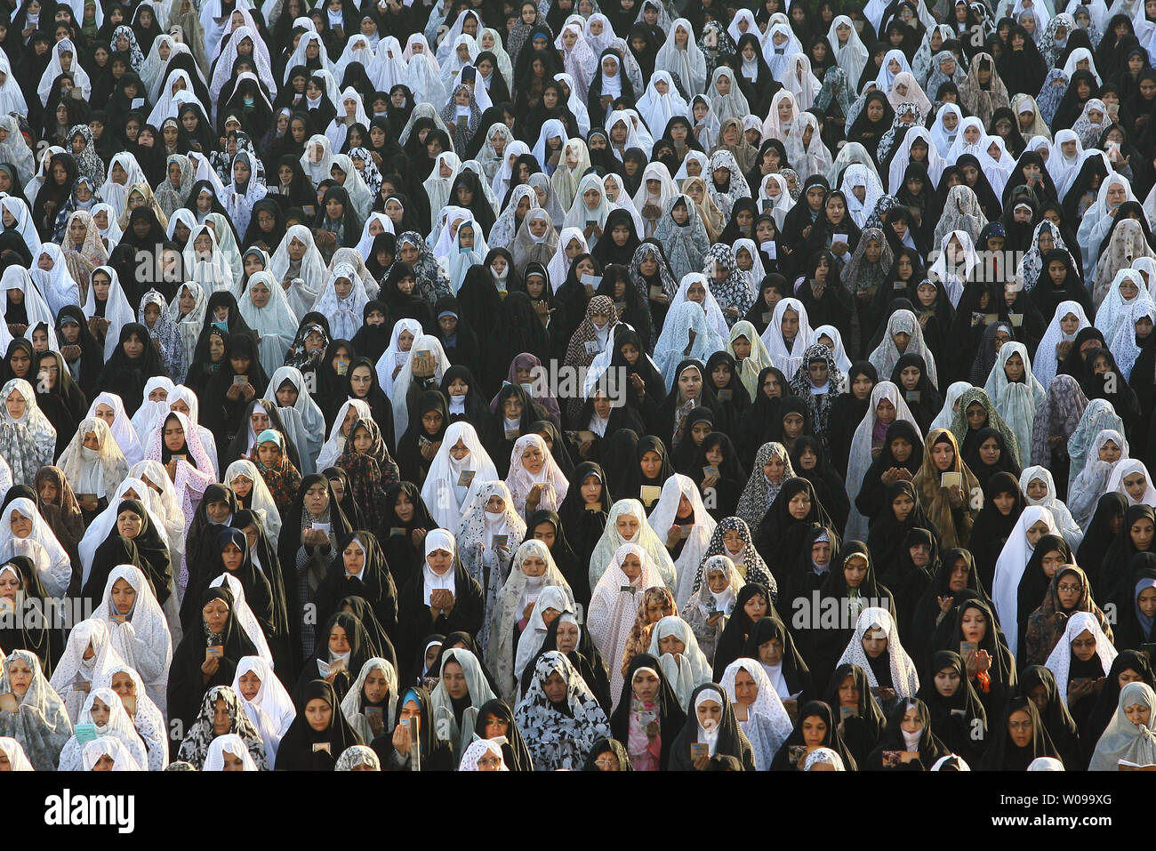 Iranian Muslim woman pray at a Naghshe Jahan Sq in Isfahan located ...