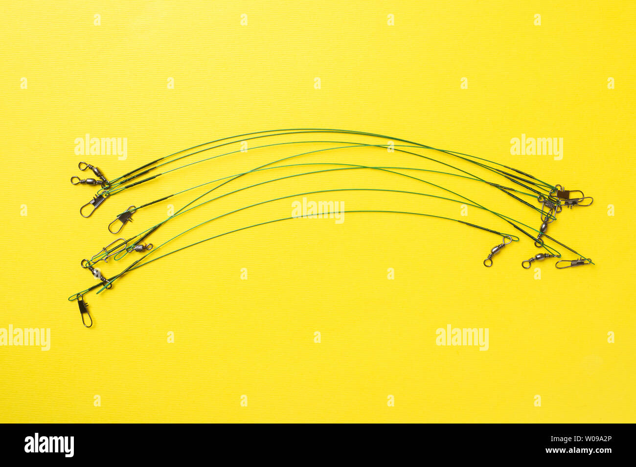 Fishing hooks and baits in a set for catching different fish on a ...