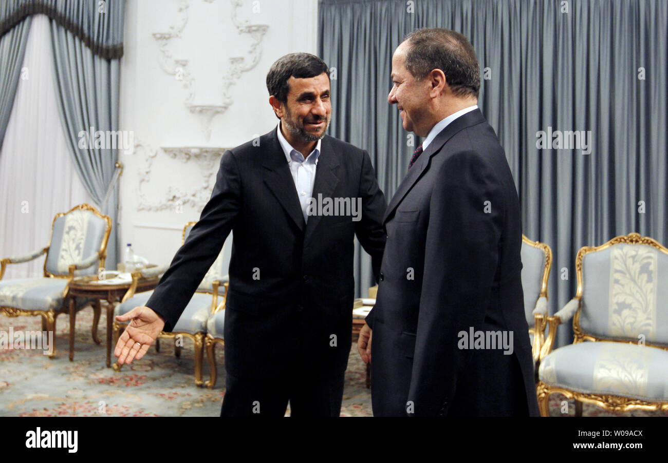Iranian President Mahmoud Ahmadinejad (L) greets Masoud Barzani, the ...