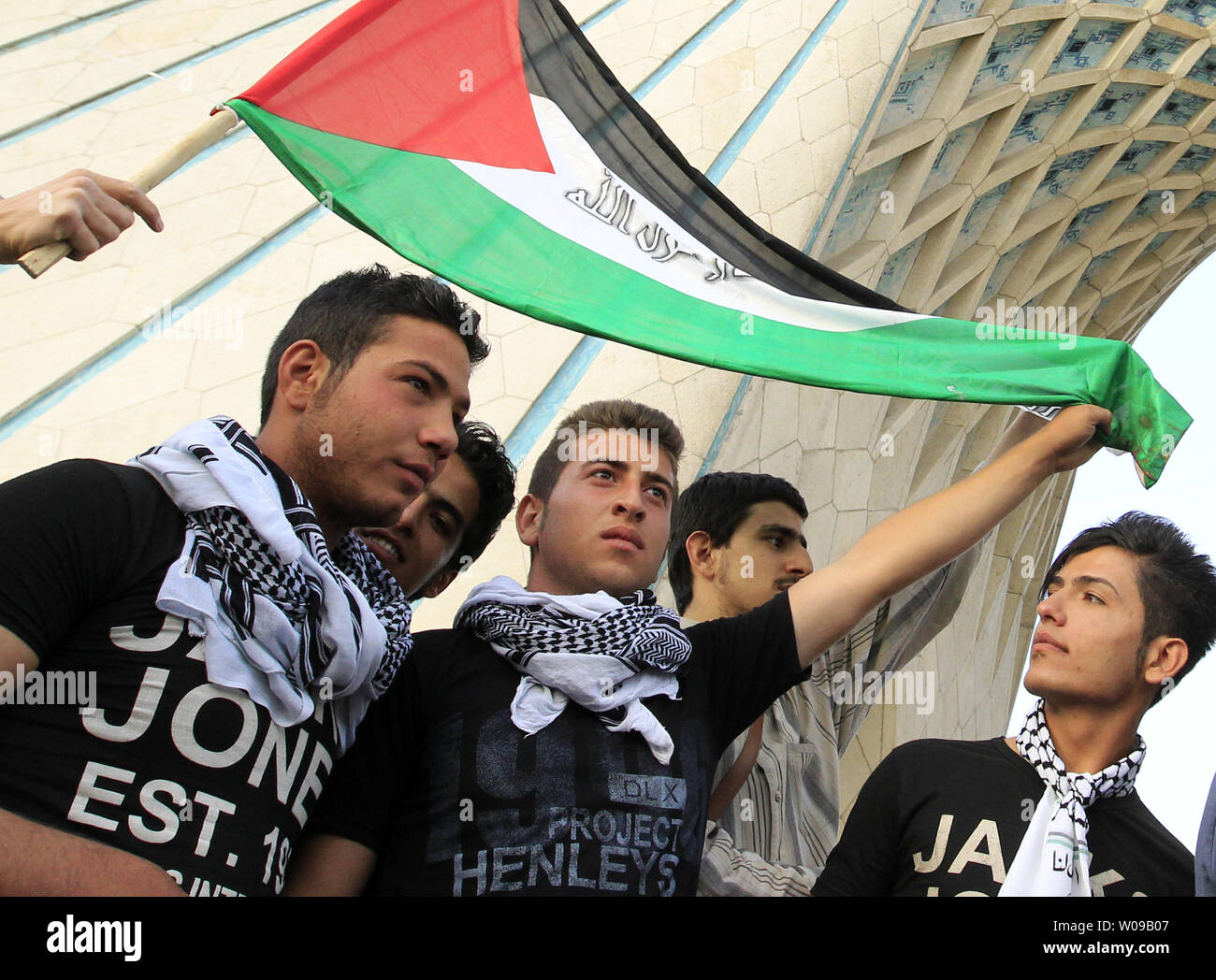 Iranian students hold a Palestinian flag during a demonstration to mark ...