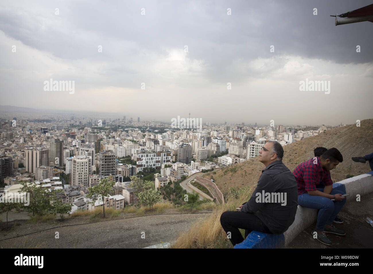 An Iranian man enjoys the view at Bame Tehran (Roof of Tehran) in the ...