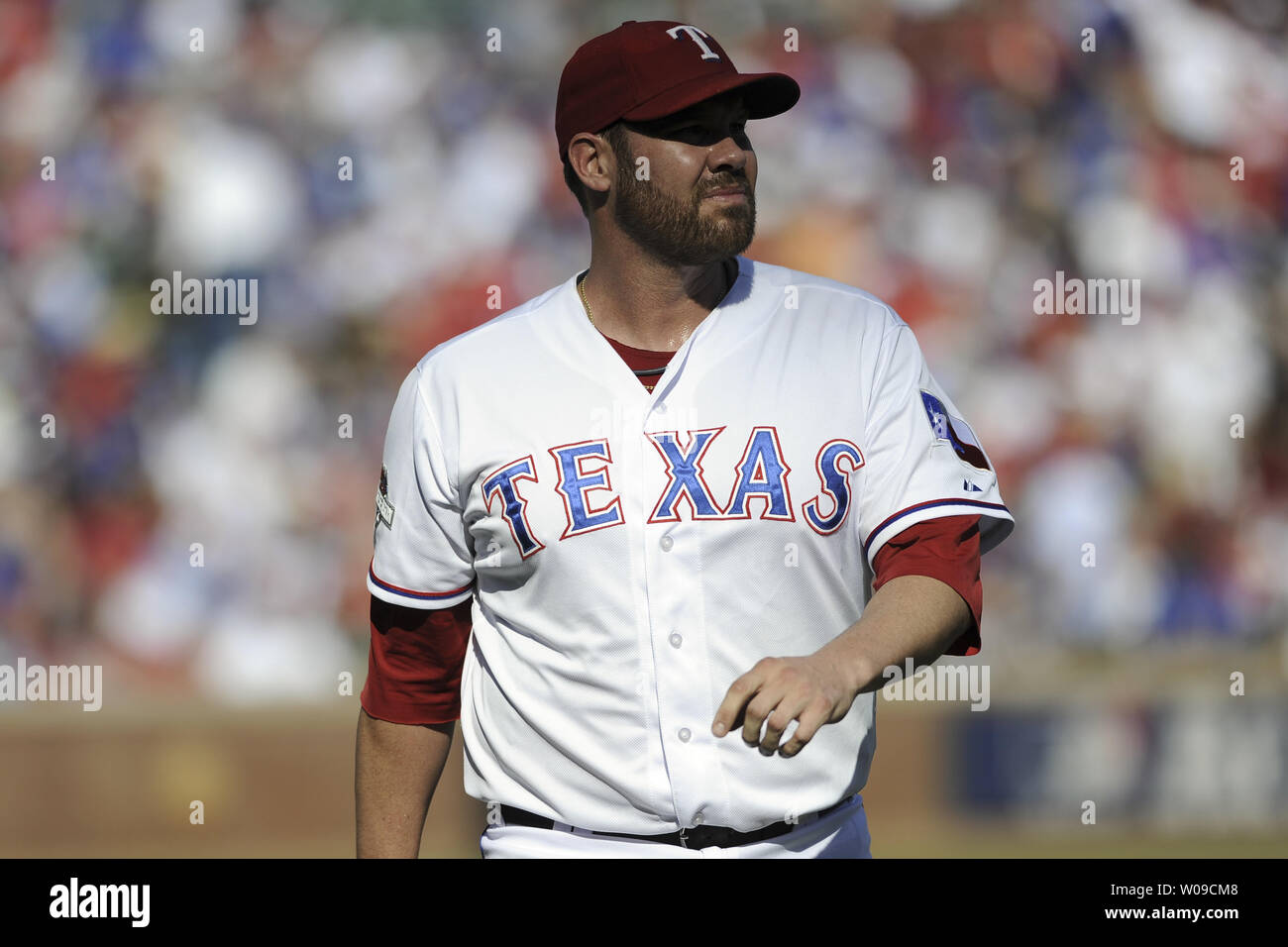 Texas Rangers pitcher Colby Lewis leaves the field after ending the ...