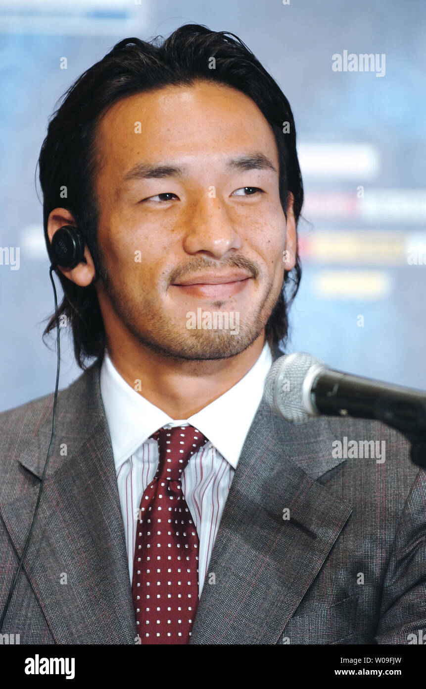 Hidetoshi Nakata answers reporter's questions during a press conference ...