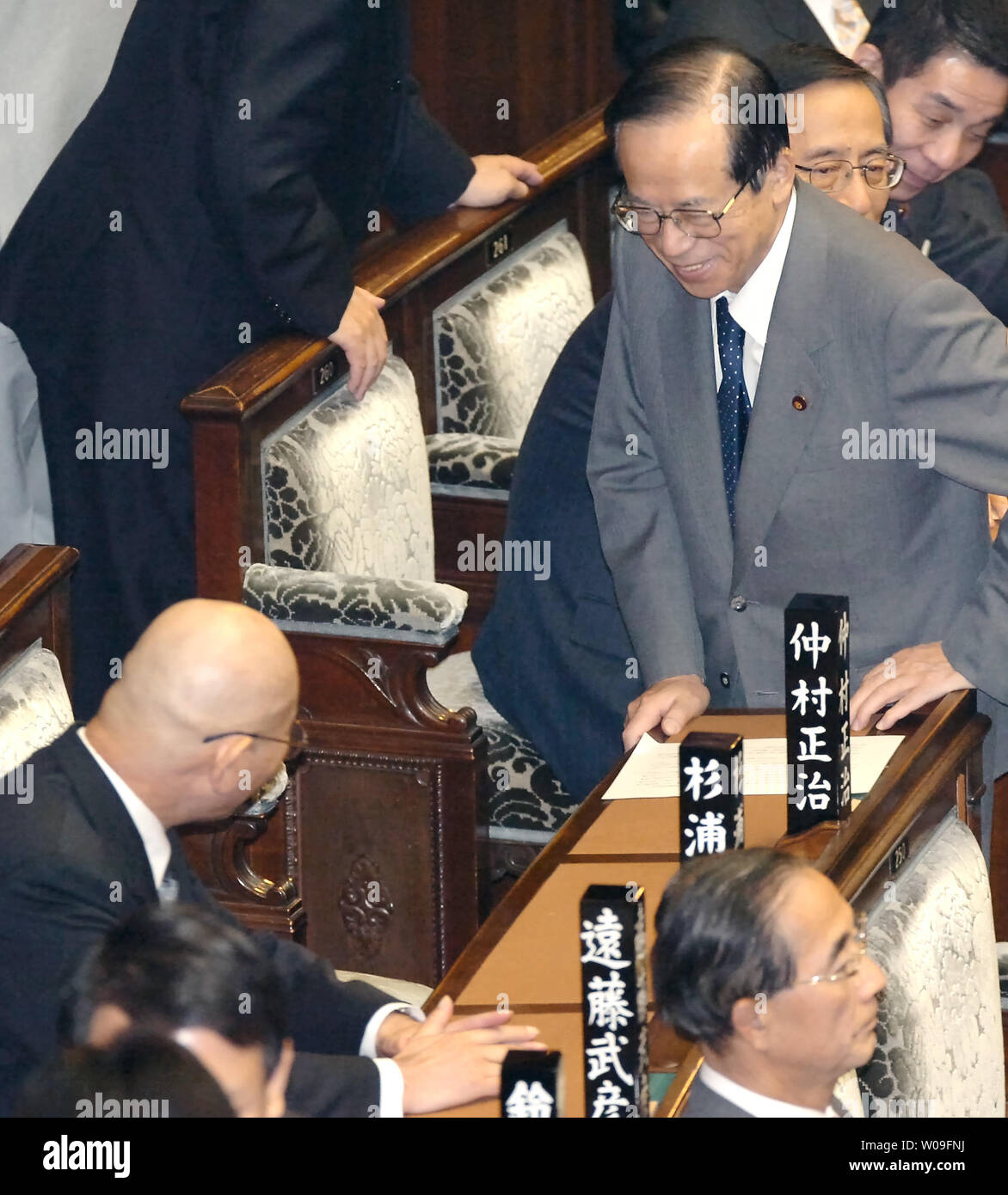 Japanese prime minister Yasuo Fukuda (R) talks with Takehiko Endo at ...