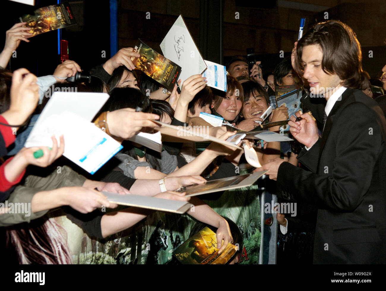Actor Ben Barnes signs autograph for Japanese fans during the premiere ...